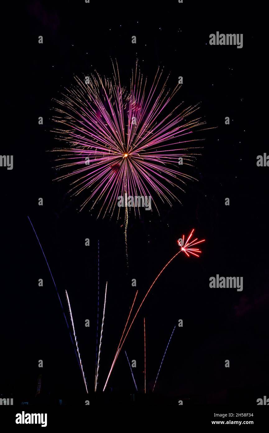 A magnificent view of exploded fireworks in the dark sky Stock Photo ...