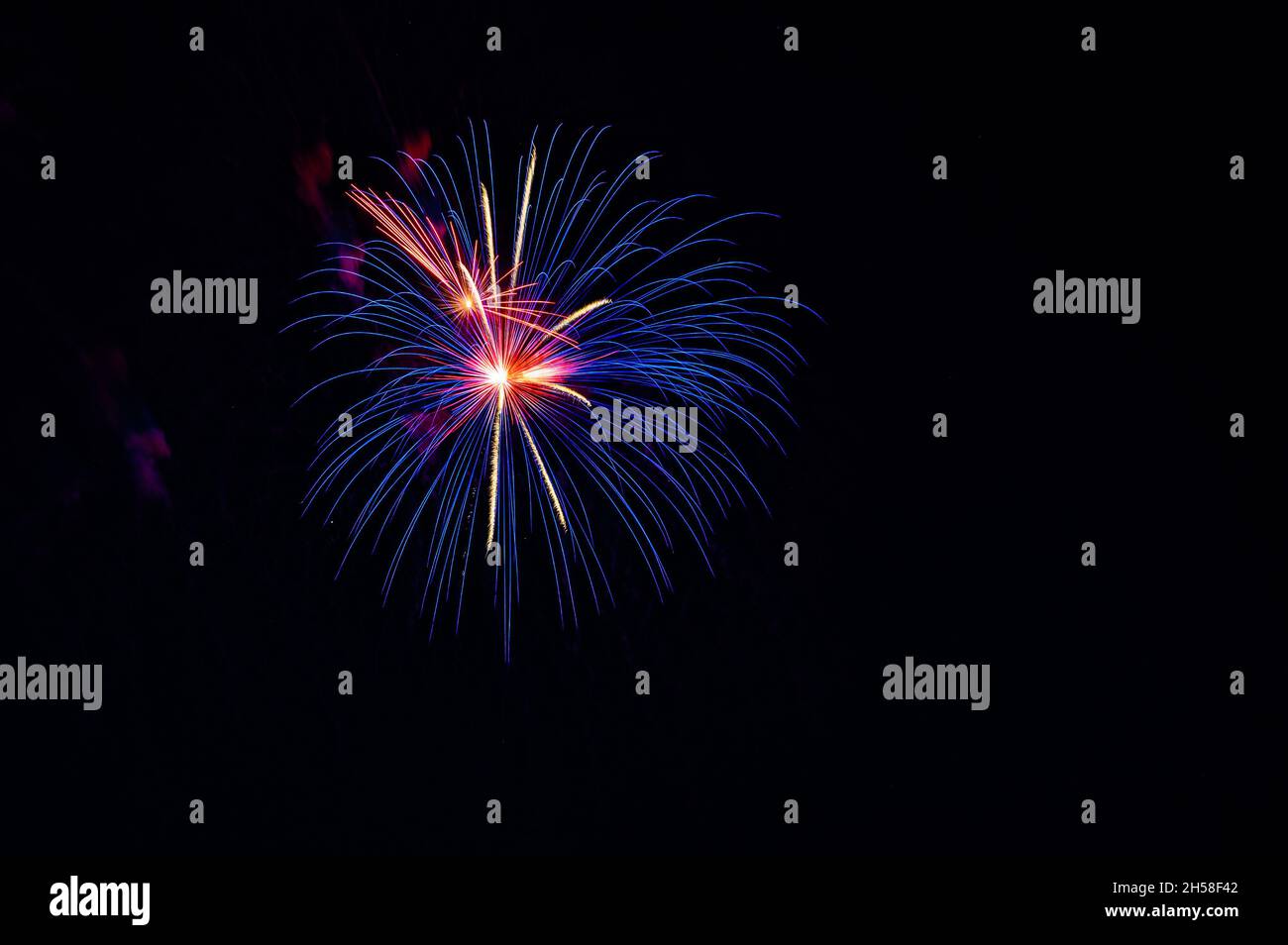 Bright firework explosion in the night sky Stock Photo - Alamy