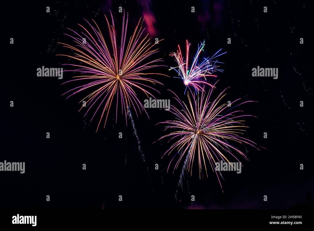 Colorful bizarre fireworks in the sky; party celebration symbol Stock ...