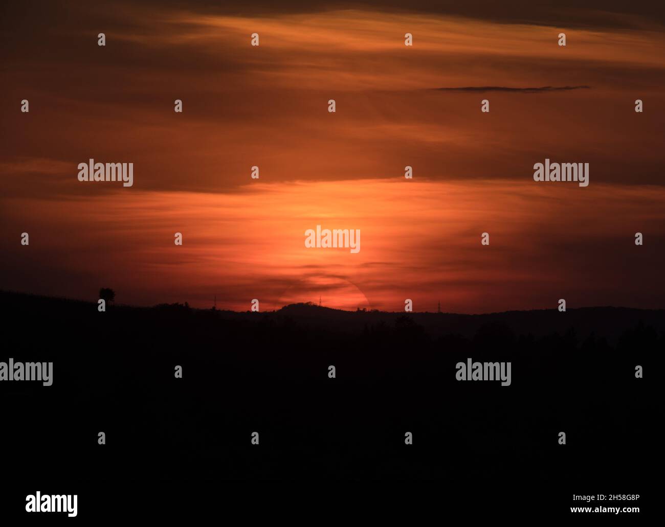 A beautiful horizontal background image of a breathtaking red sunset ...