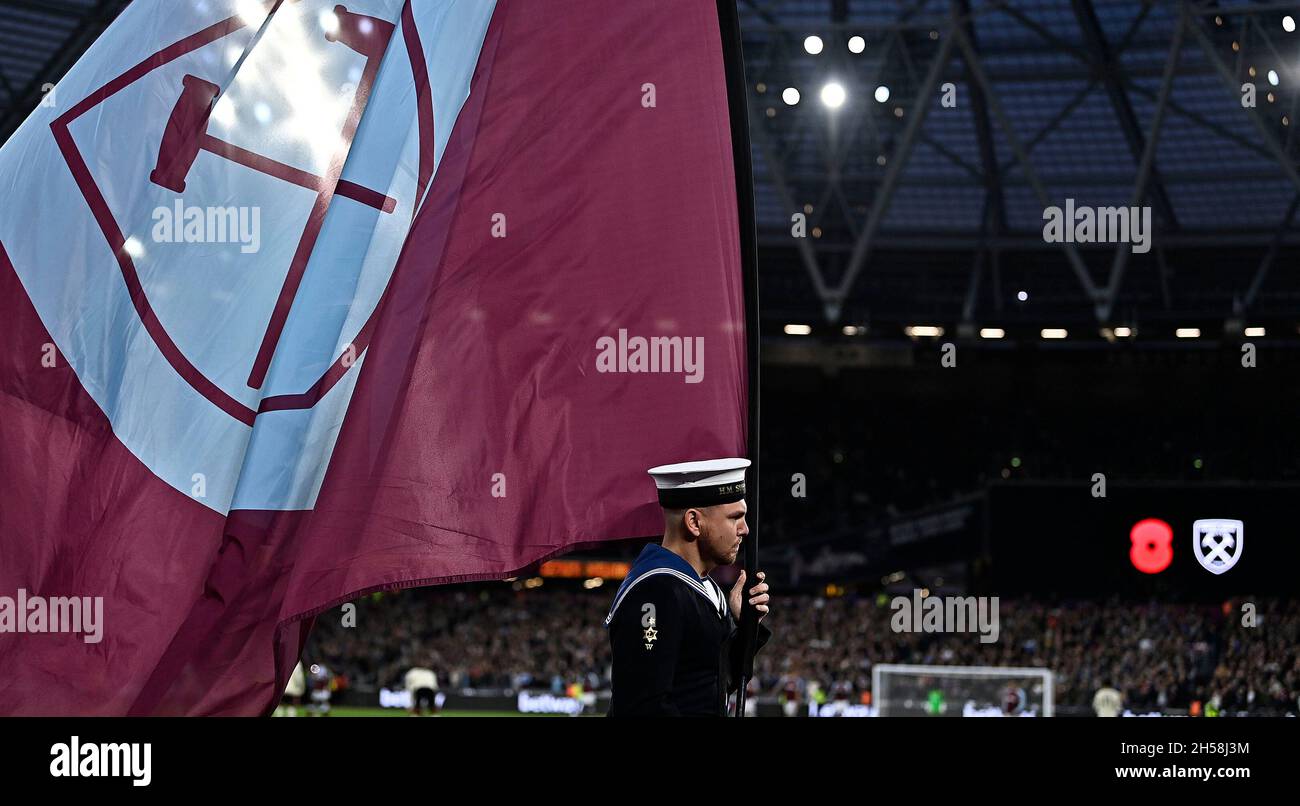 London, UK. 7th Nov, 2021. A large Hammers flag is held by a submariner ...