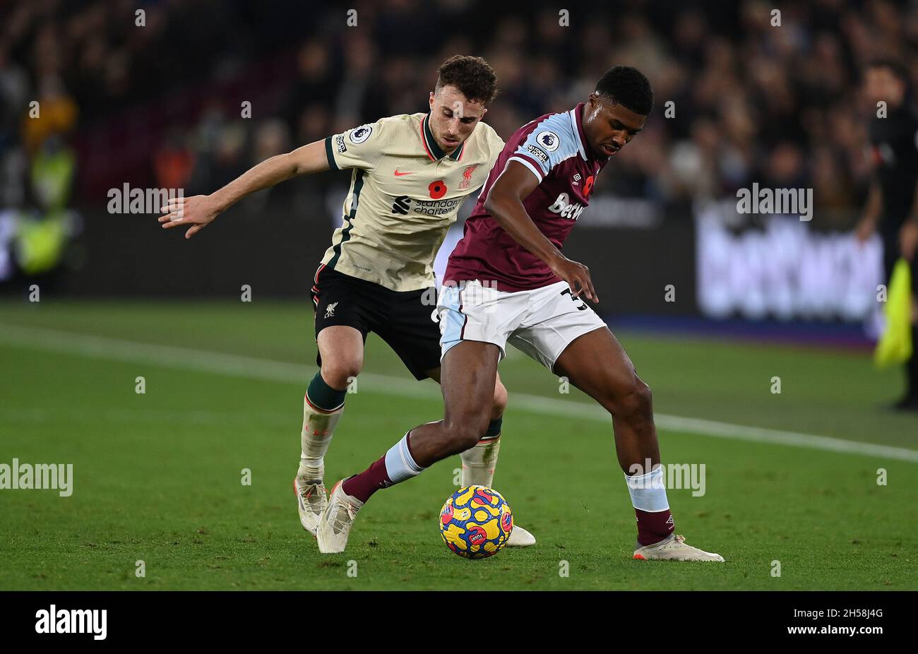 London, UK. 7th Nov, 2021. Ben Johnson (West Ham) holds off Diogo Jota ...