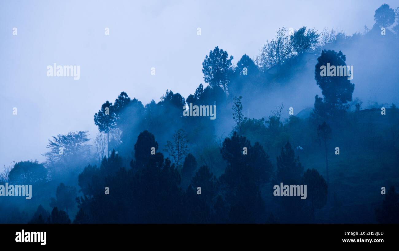 Blue mountains with rain and fog Stock Photo - Alamy