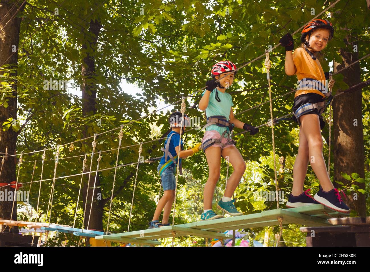 The kids are climbing on the suspension bridge Stock Photo - Alamy