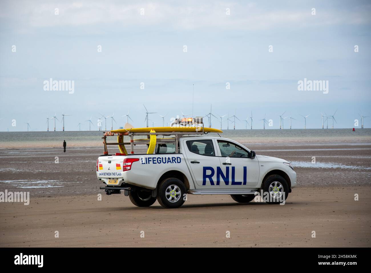 RNLI Lifeguard Mitsubishi 4x4 pick up truck on Crosby Beach, Merseyside ...