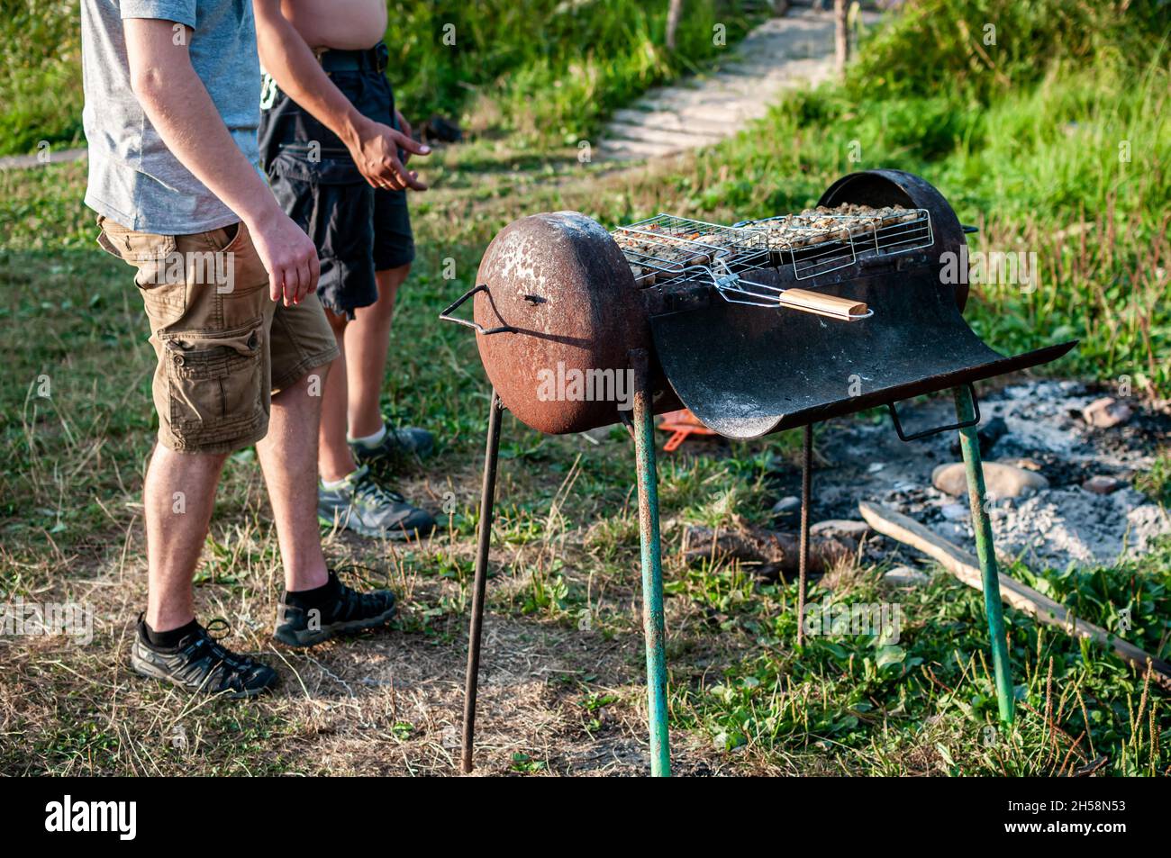 grilled meat skewers chicken the meat holder over fire burned churcoal ...