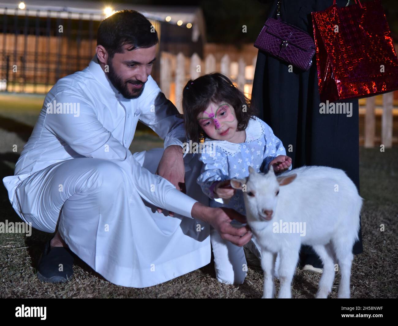 Riyadh, Saudi Arabia. 7th Nov, 2021. A family feed a yeanling during ...