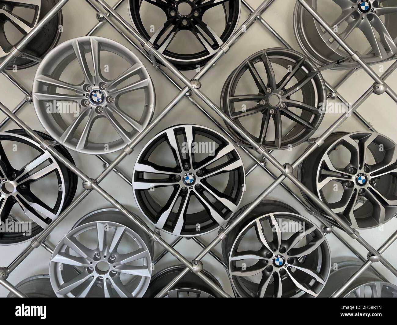Kyiv, Ukraine. May 9, 2021. BMW car rims hang on a wall at a car ...
