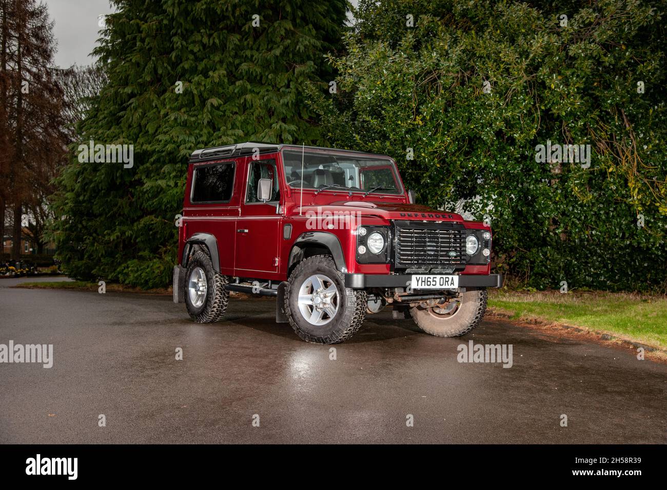 Late model Land Rover Defender 90 parked in a car park in a rural ...