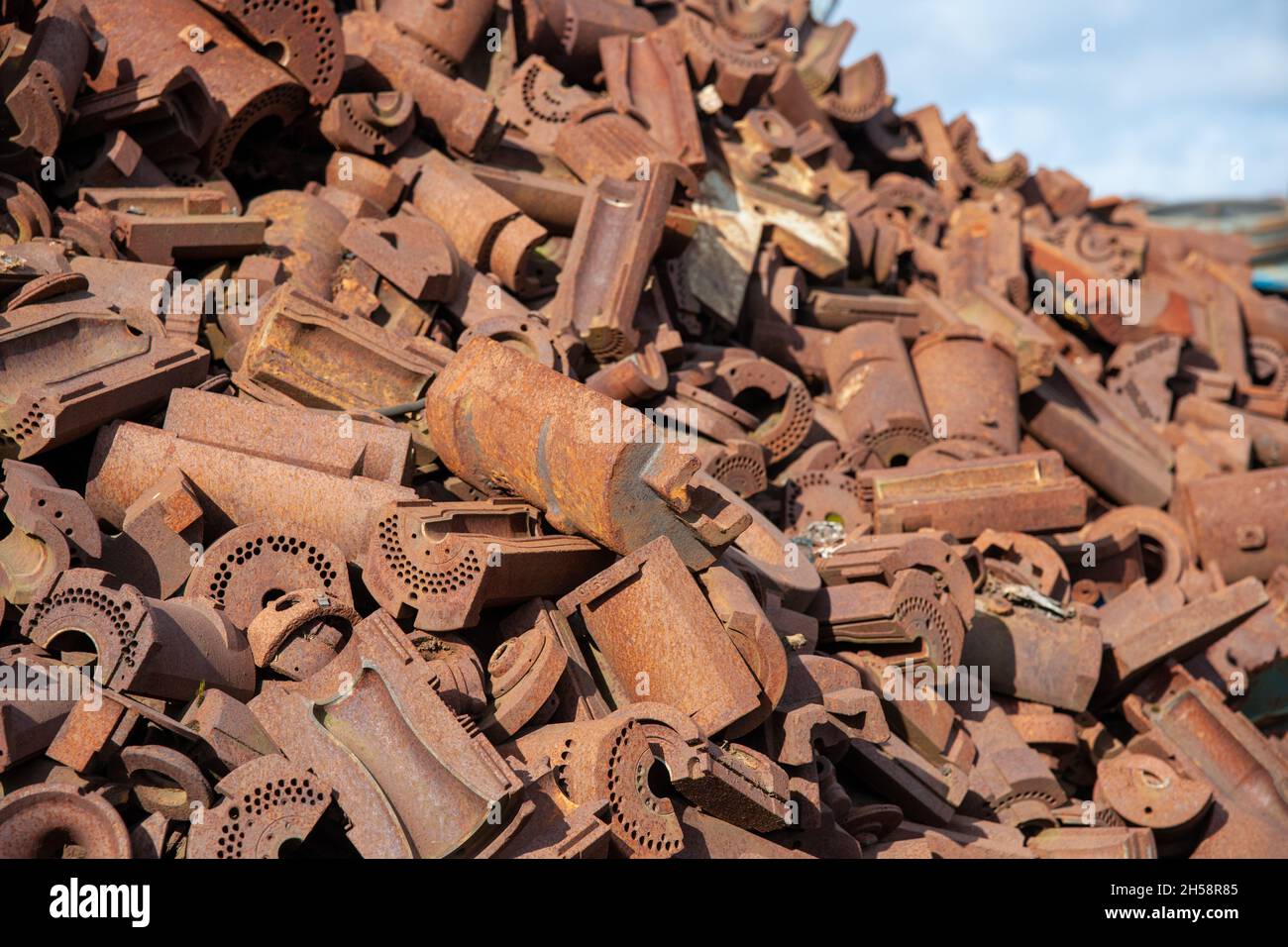 Piles of broken cast scrap steel in a scrap yard Stock Photo - Alamy