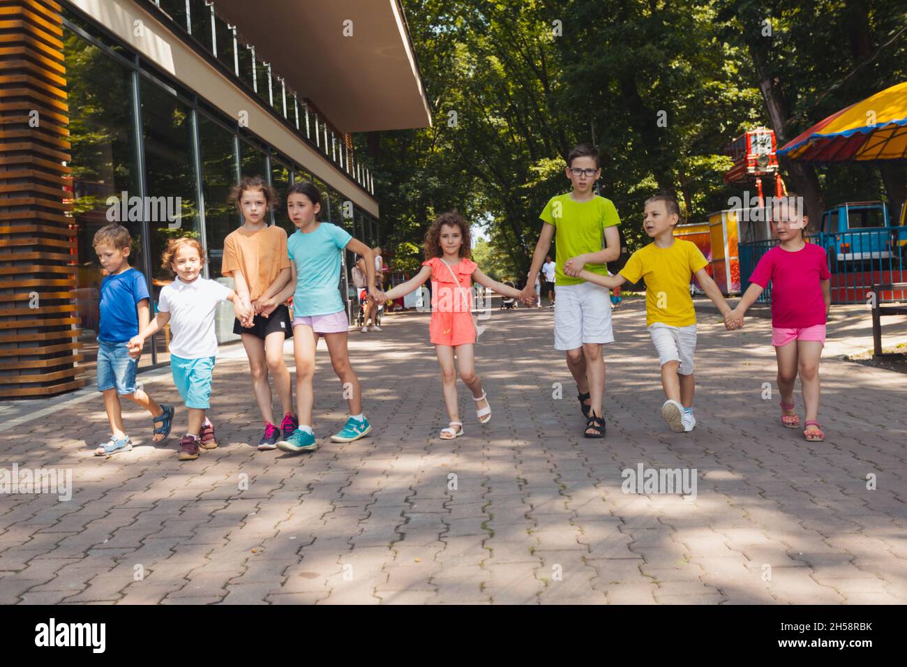 The group of excited preschoolers are running together Stock Photo - Alamy