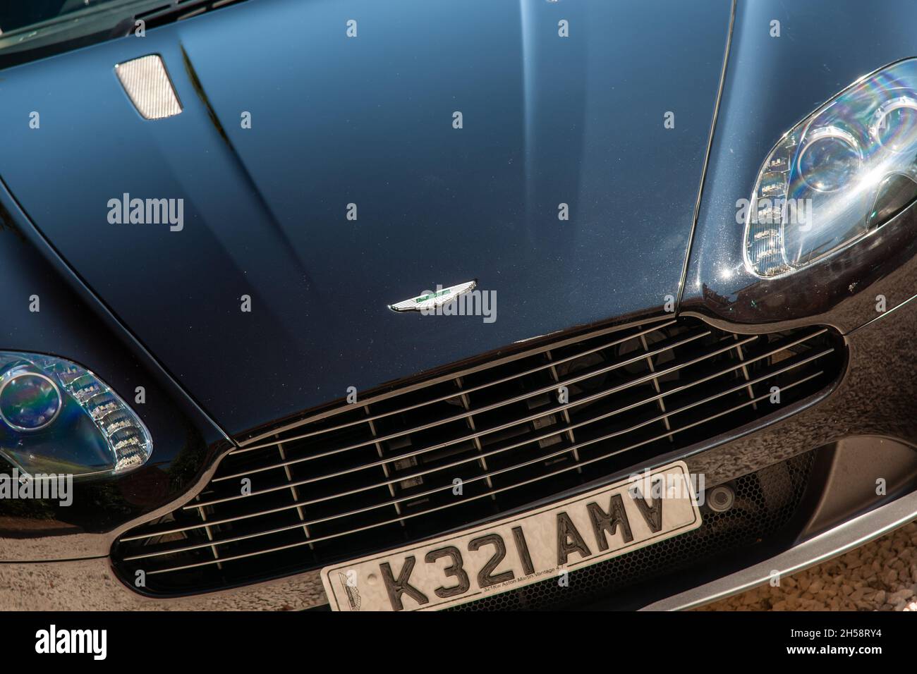 2012 Aston Vantage name badge, bonnet and grill detail Stock Photo - Alamy