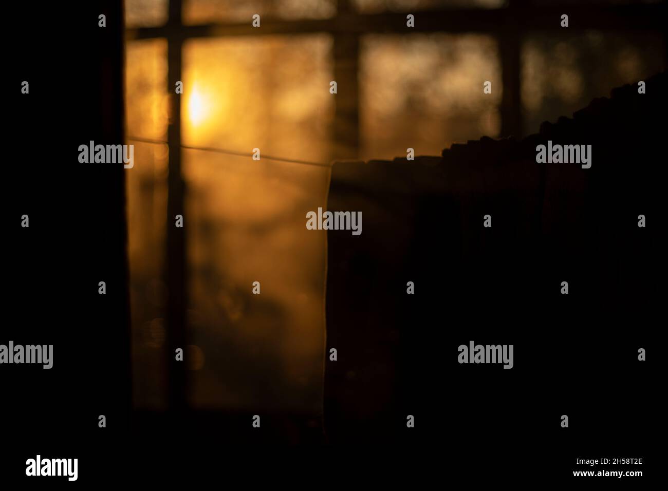 The sun shines through the window in the morning. Warm atmosphere in ...
