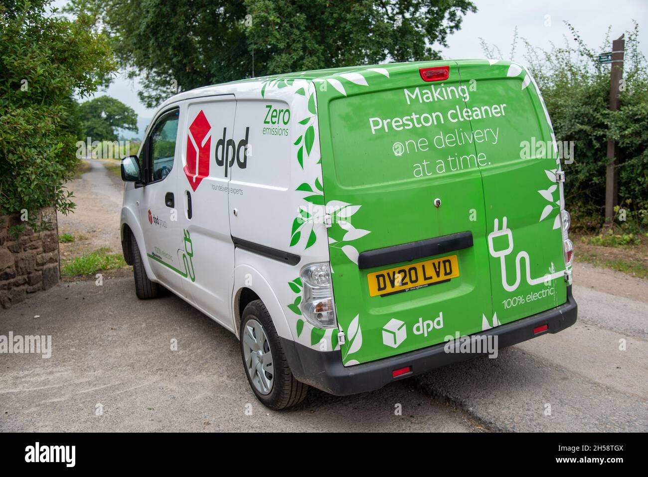 Nissan E-NV200 electric van driving along a country lane, delivering ...