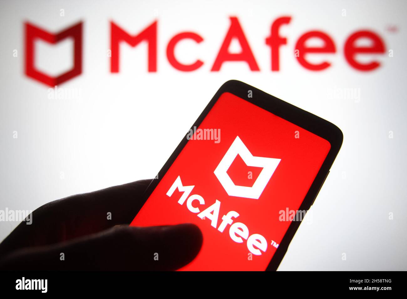 In this photo illustration, a McAfee Corp. logo is seen on a smartphone ...