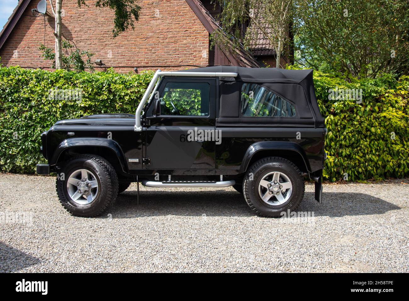 Land Rover Defender SVX 90 special edition parked on a gravel drive in ...
