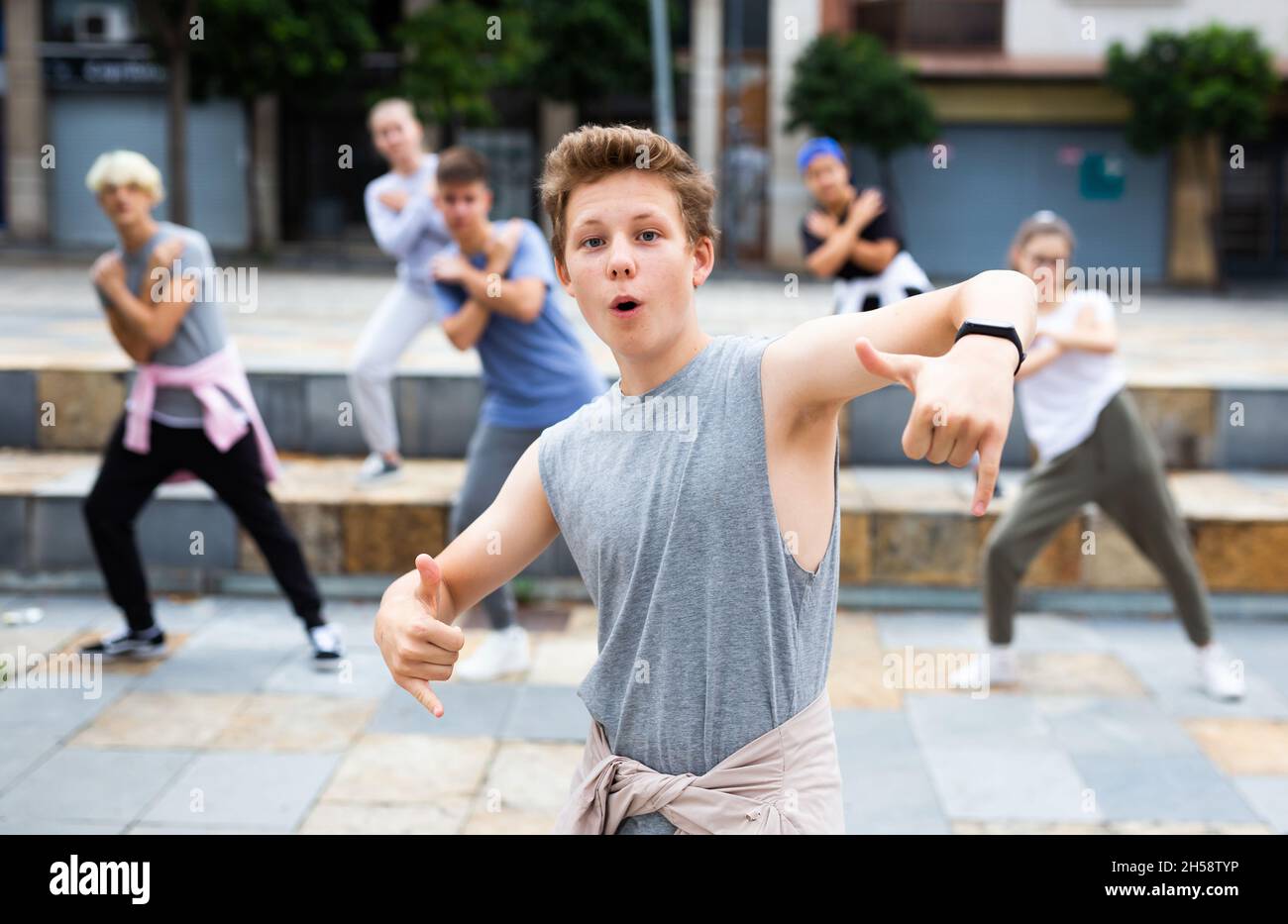 Teen boy dancing modern street dance with teenagers Stock Photo - Alamy