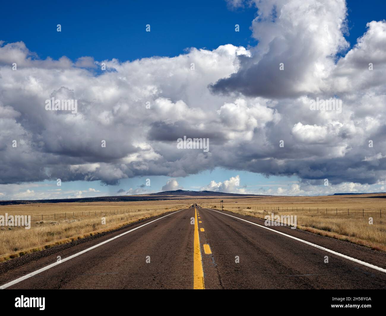 Huge cumulus clouds seem to swoop low over the Round Valley near ...