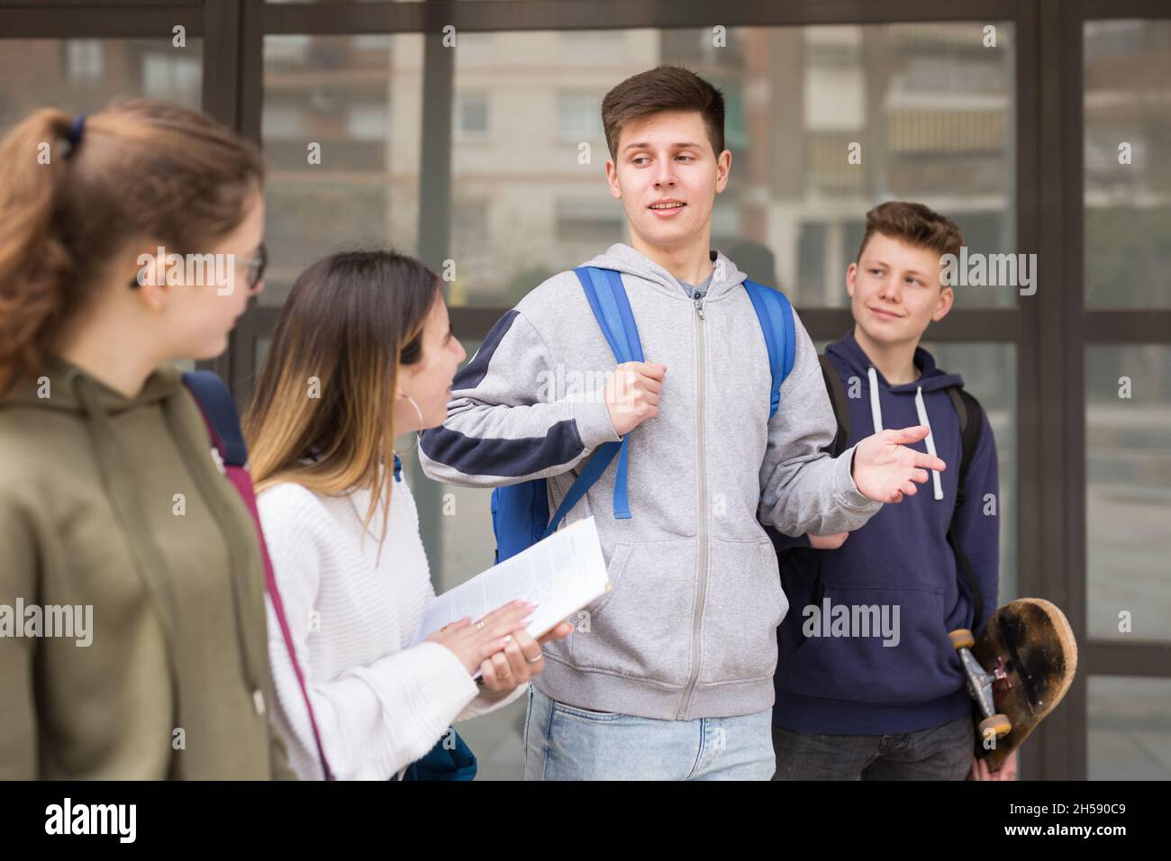 Carefree teen students walking outside school Stock Photo - Alamy
