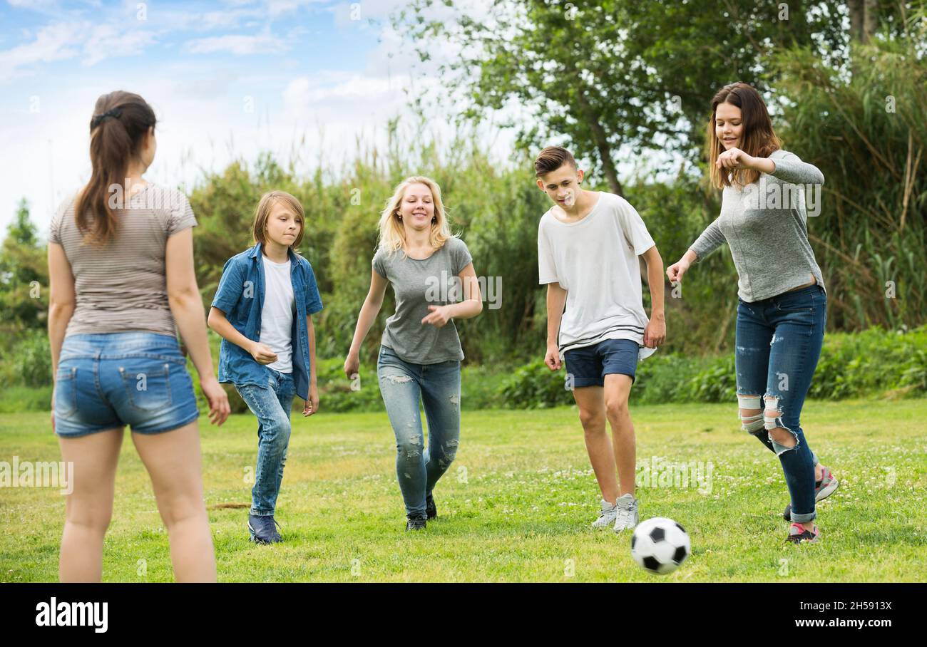 Teenagers kicking ball hi-res stock photography and images - Alamy