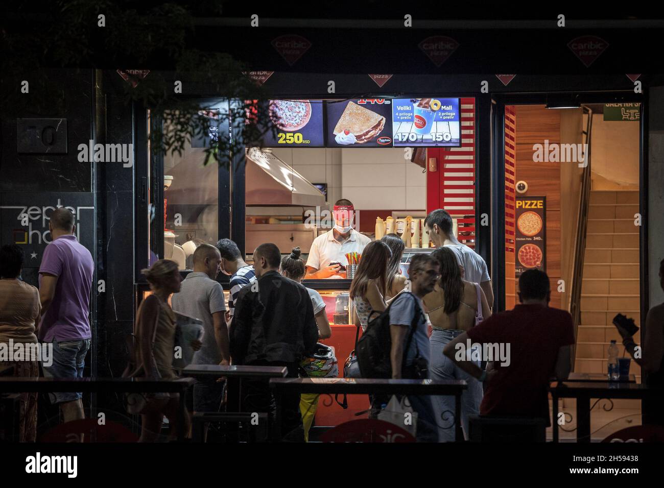 Picture of a staff workers cooking at a terrace of a pizza fast food in ...