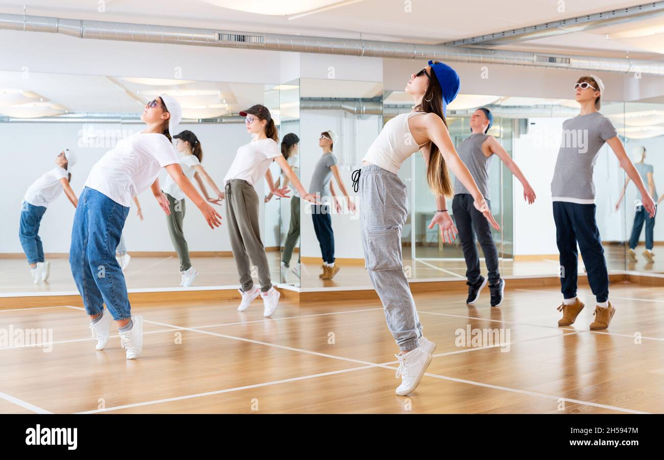 Joyous boy and girls dancing hip hop at lesson in the class Stock Photo ...