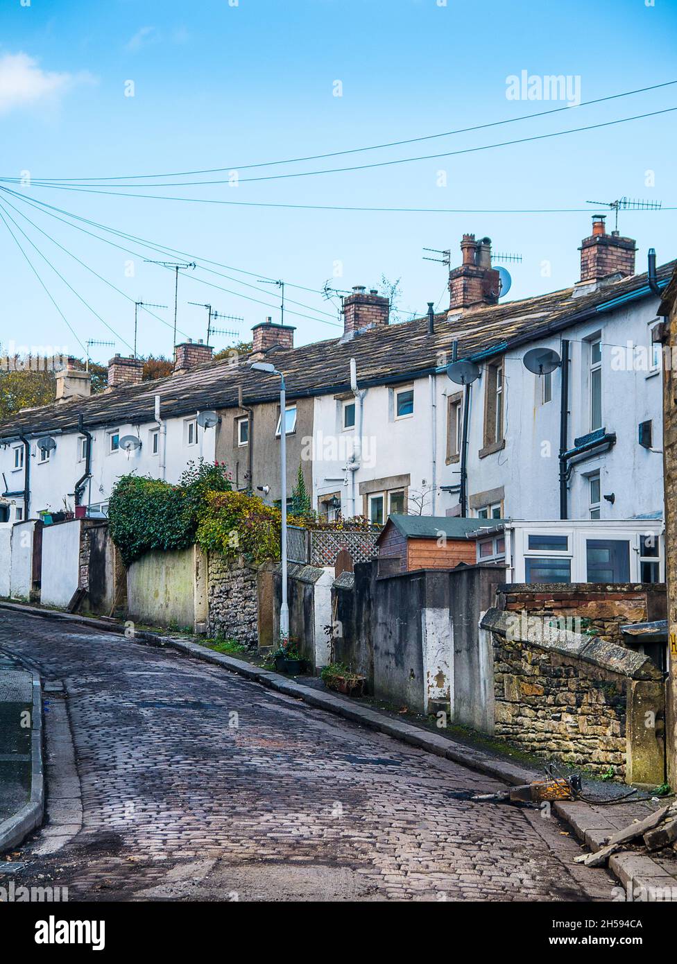 Terraced houses with back yards and high walls were built for workers ...