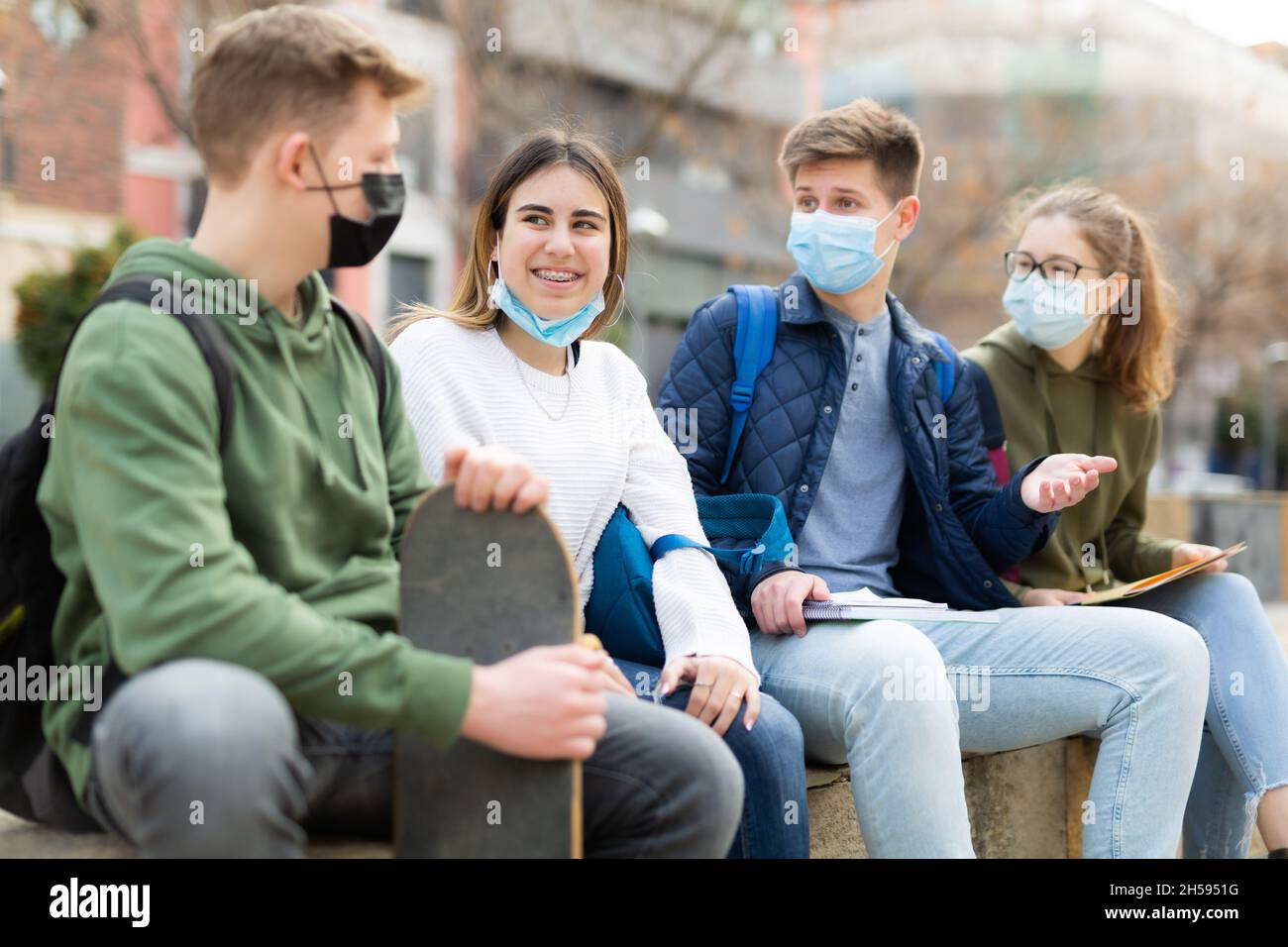 Diverse group of teens wearing masks hi-res stock photography and ...