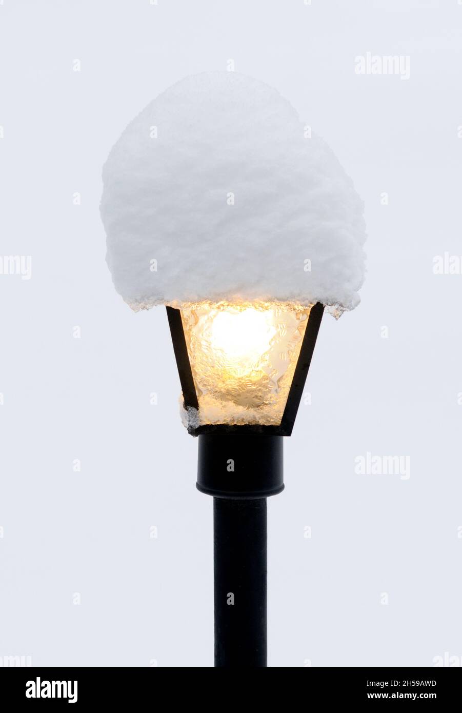 Outdoor lamp covered in snow Stock Photo - Alamy