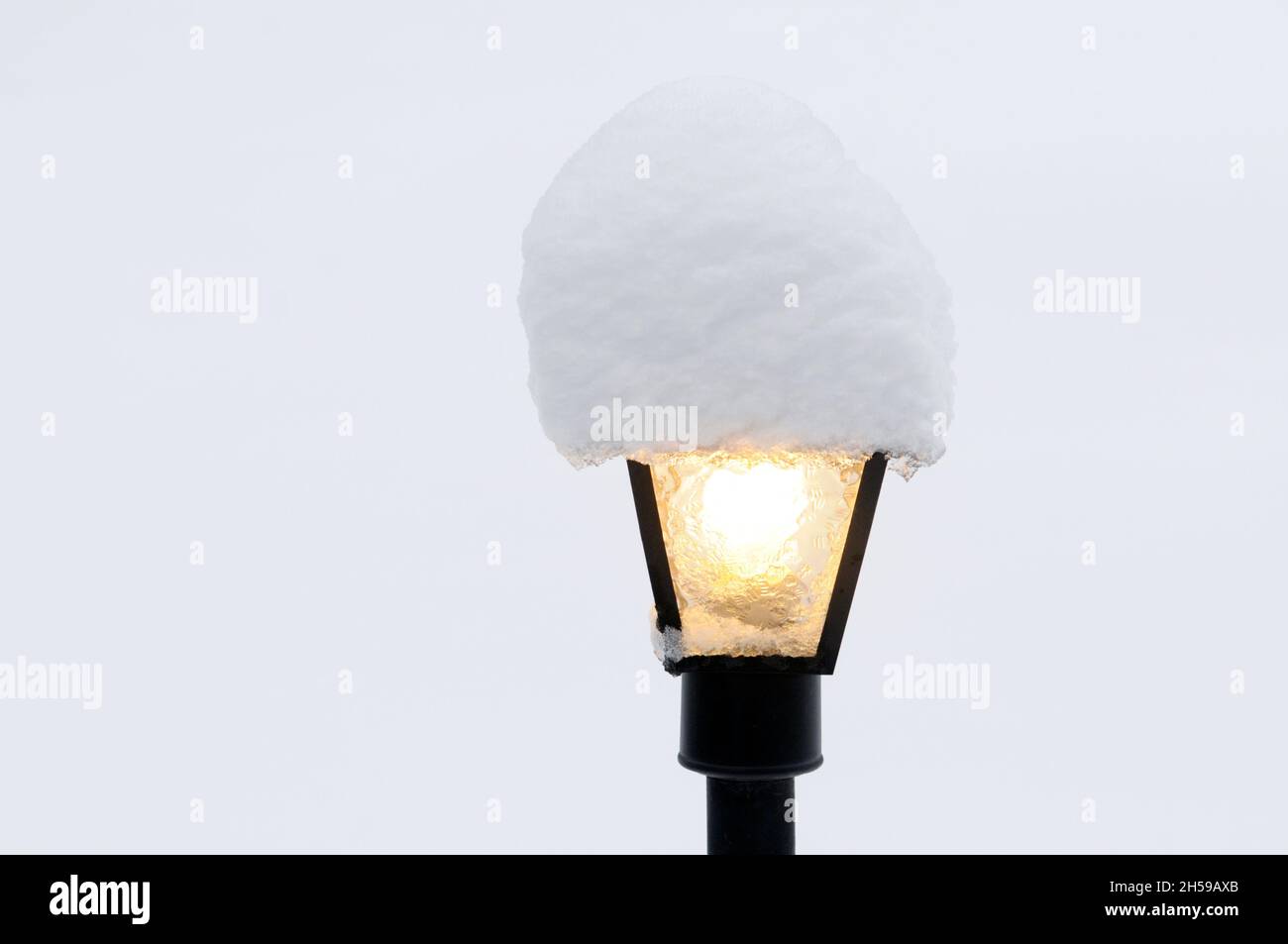 Outdoor lamp covered in snow Stock Photo - Alamy