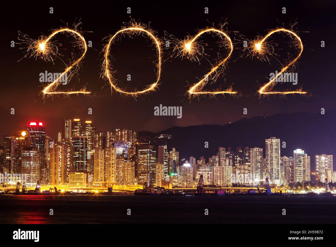 2022 Happy New Year fireworks celebrating over Hong Kong cityscape at ...