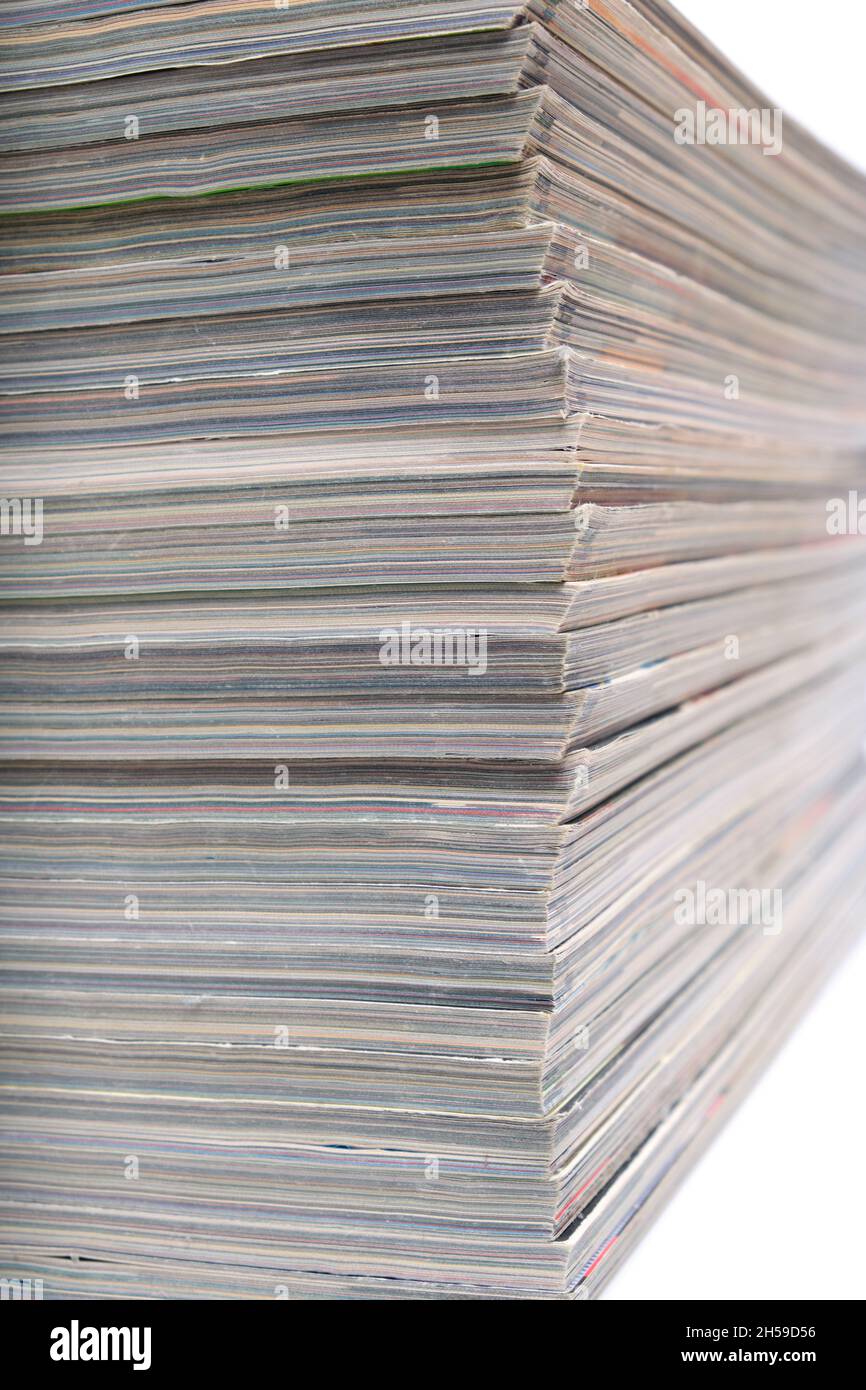 Stack of magazines and newspapers on a white background Stock Photo - Alamy