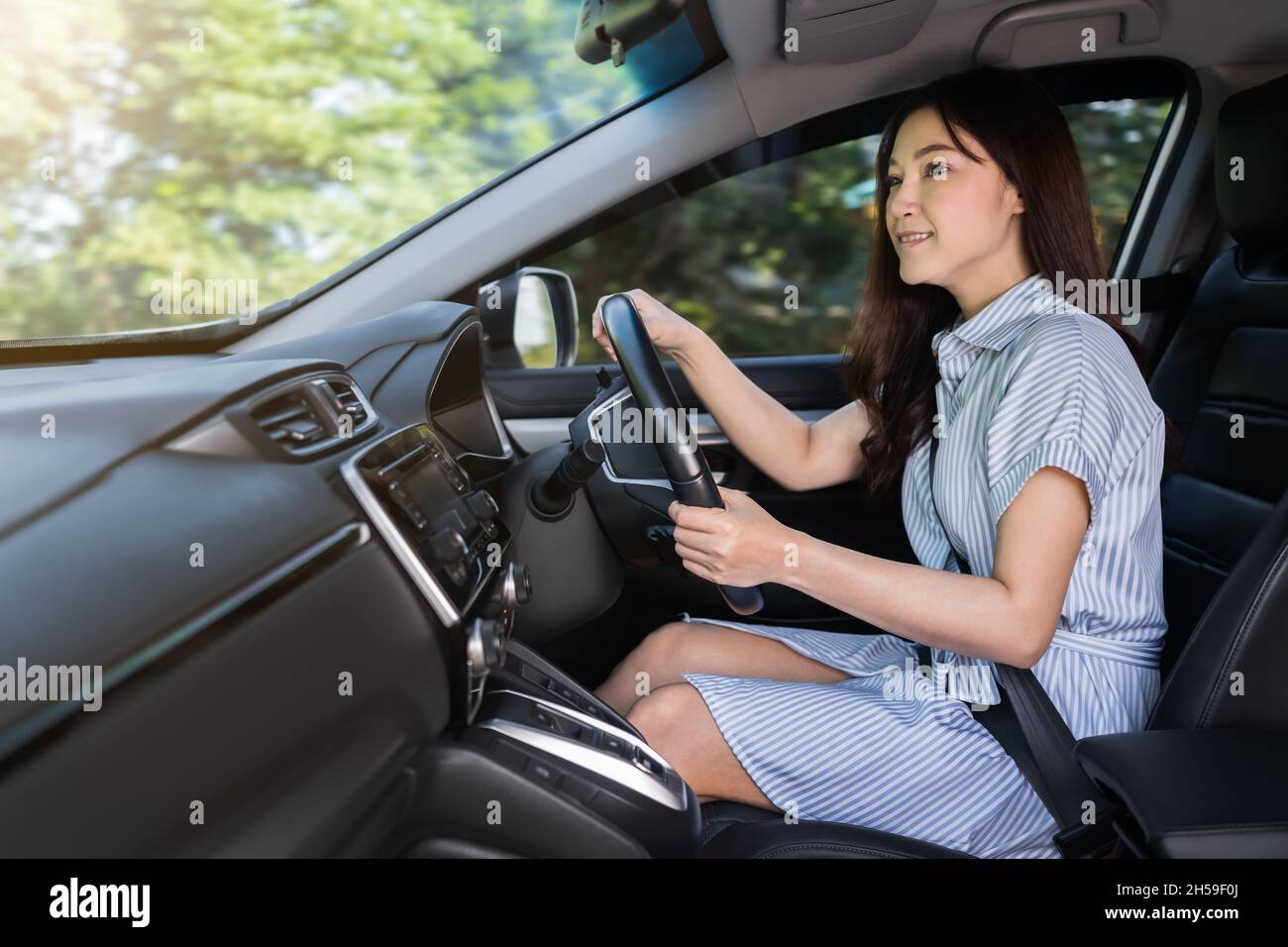 Asian woman driving car hi-res stock photography and images - Alamy