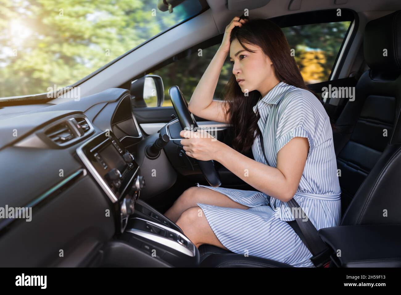 stressed woman driver sitting inside a car Stock Photo - Alamy