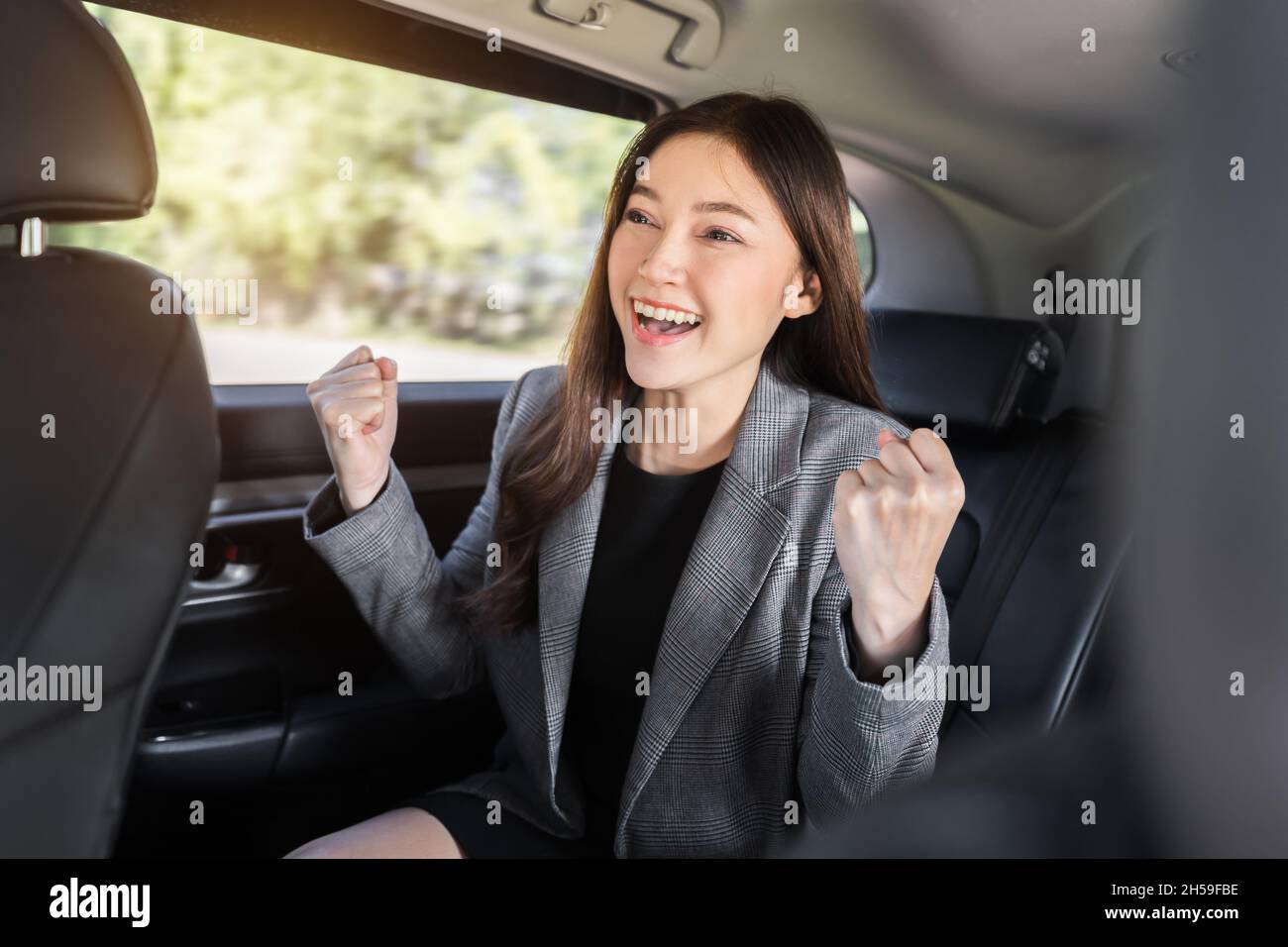 Carefree businesswoman hand raised hi-res stock photography and images ...