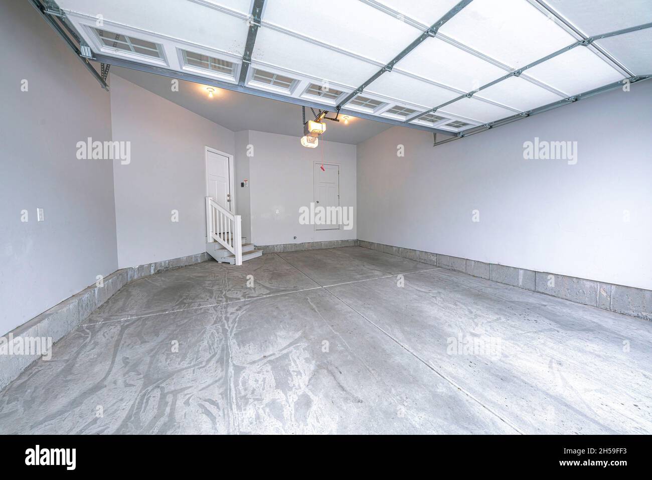 Empty interior of a white garage from an angle to the left Stock Photo ...