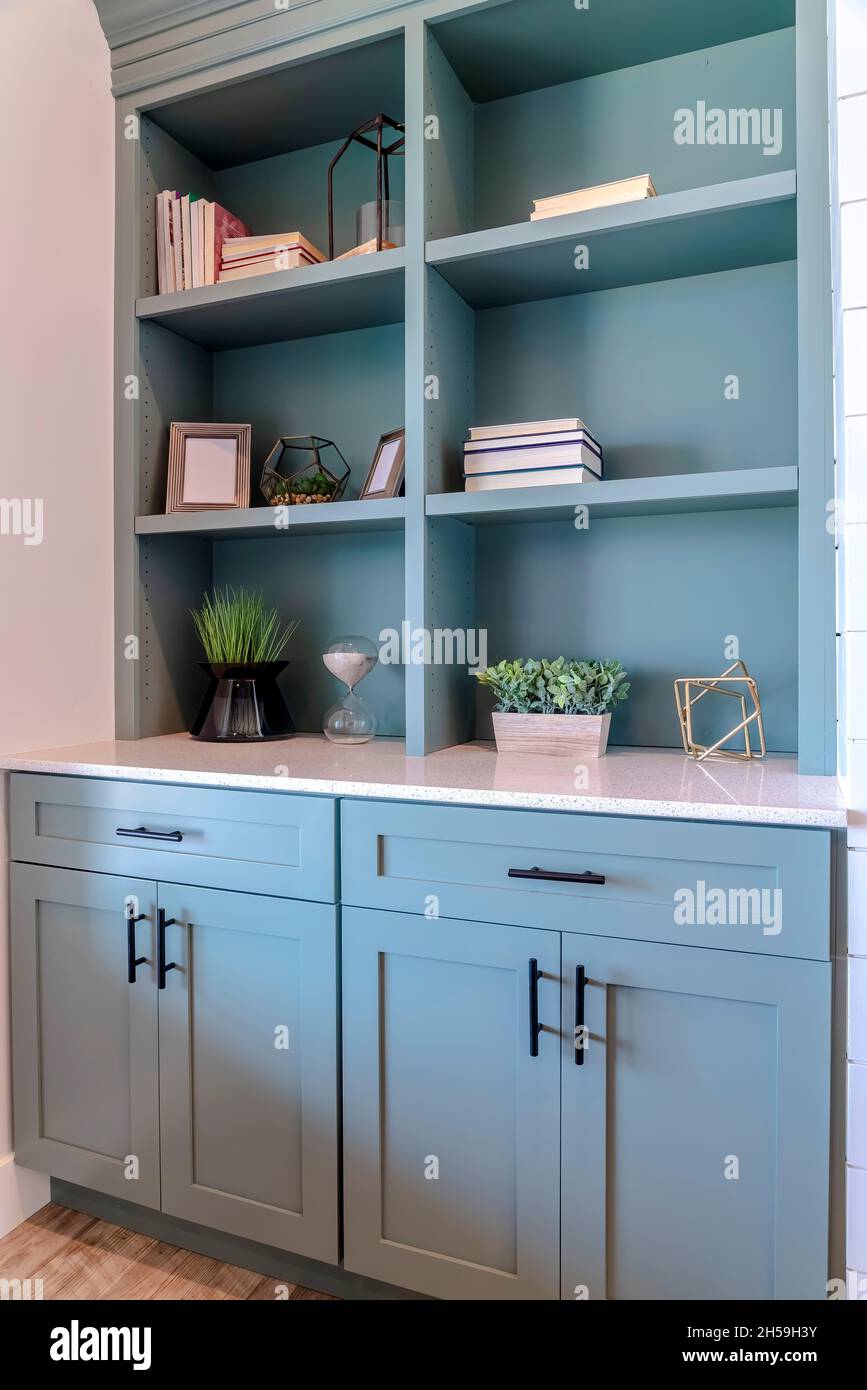 Built in cabinet with shelves drawers and doors inside living room of ...