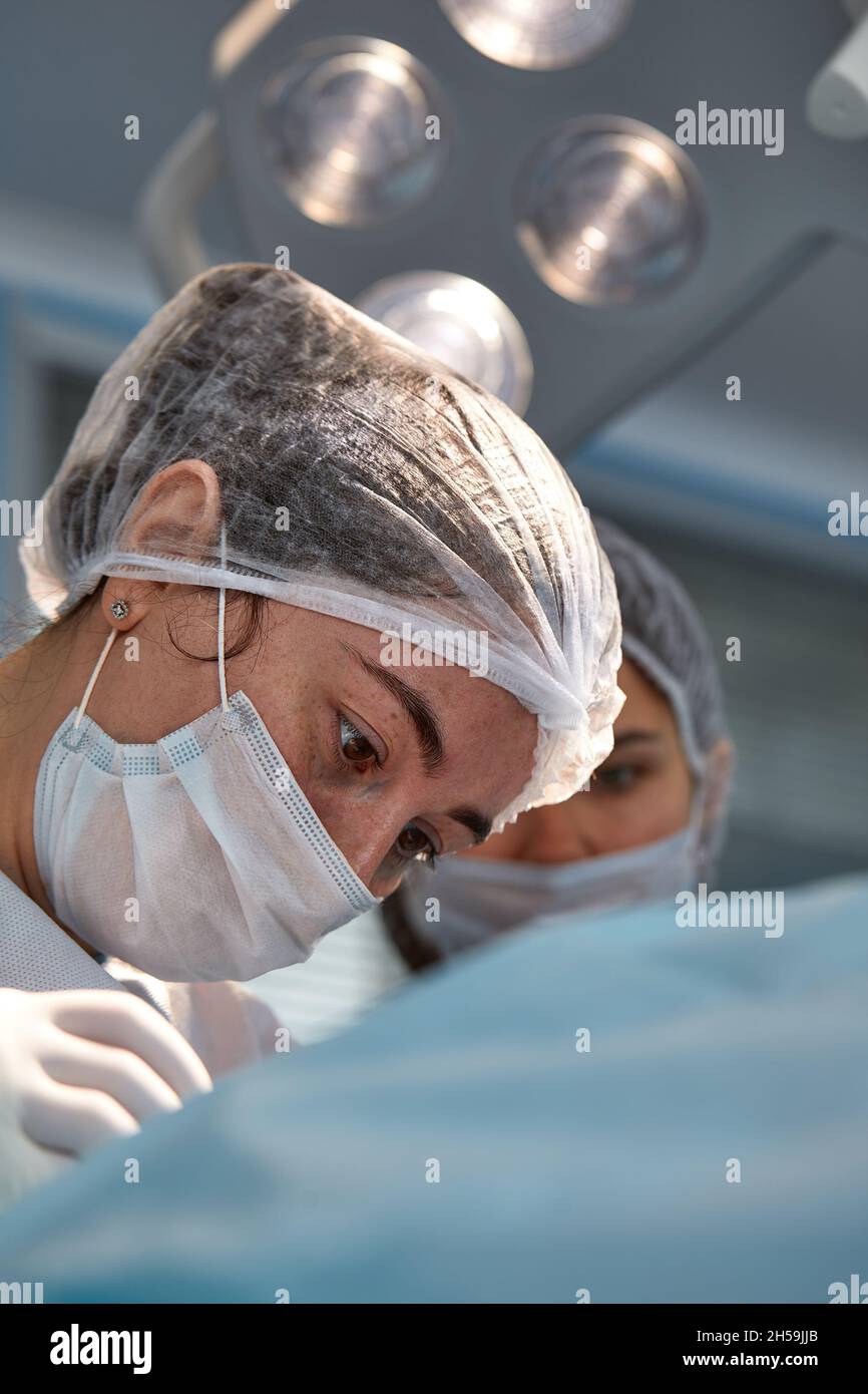 Close up of the face of a patient who is undergoing blepharoplasty. The ...