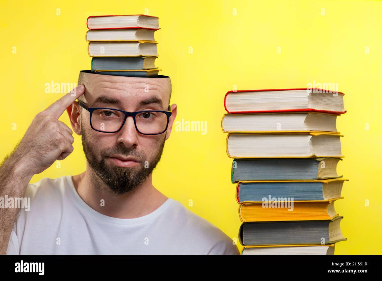 Concept Of Education A Bald Bearded Man With Glasses Points A Finger