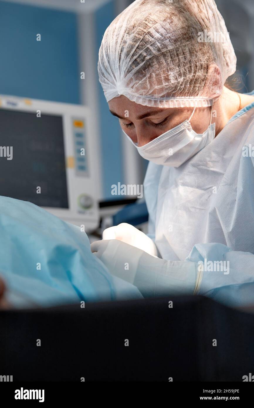 Close up of the face of a patient who is undergoing blepharoplasty. The ...