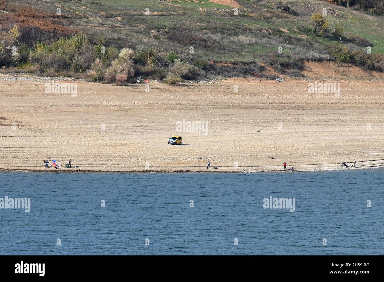Debar. 7th Nov, 2021. People fish at Debar Lake in North Macedonia on ...