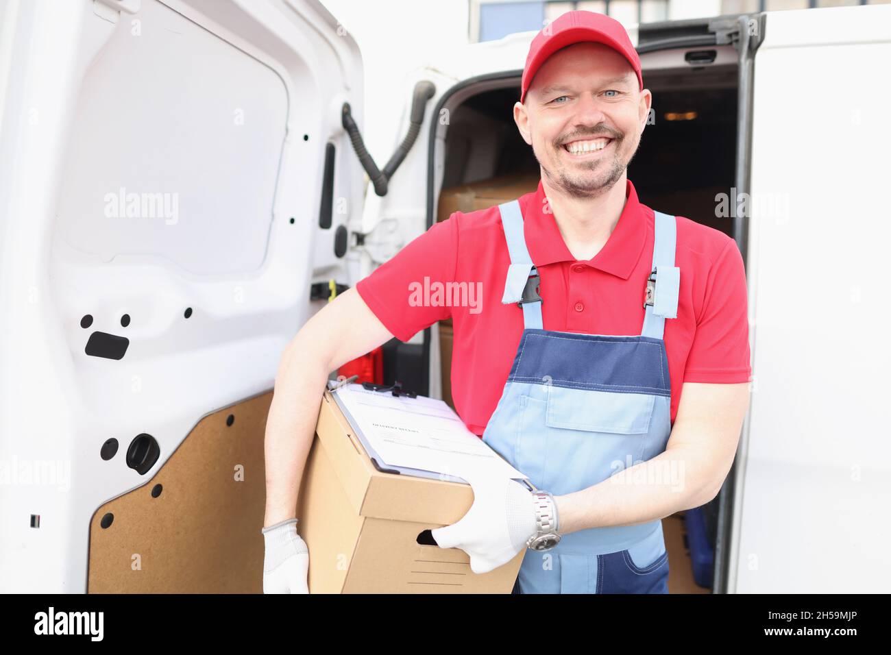 Worker in red uniform hi-res stock photography and images - Alamy