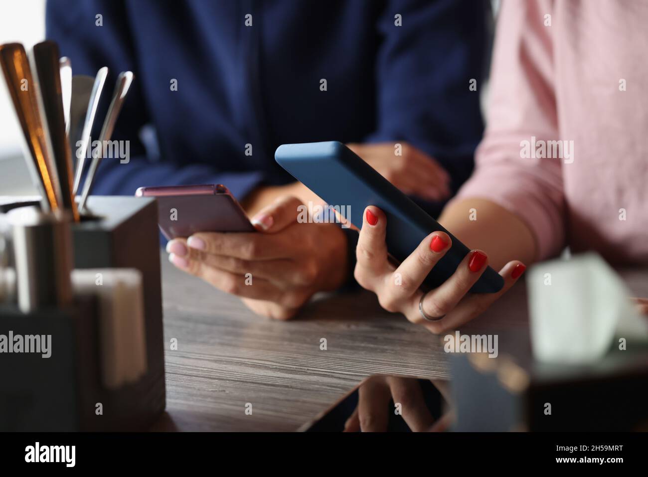 People hold mobile phones in hands Stock Photo - Alamy