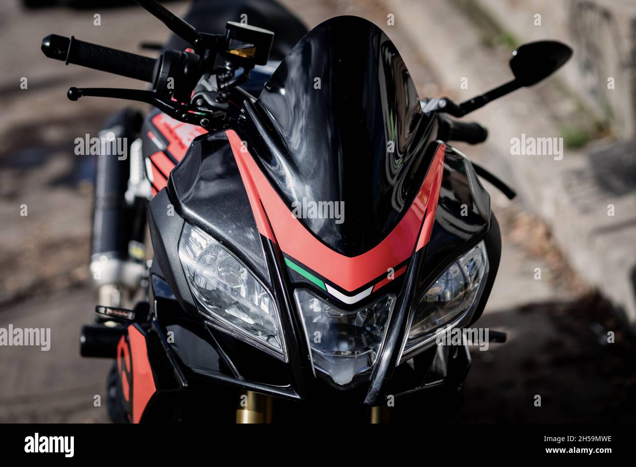 Headlight of the black sports motorcycle Stock Photo - Alamy