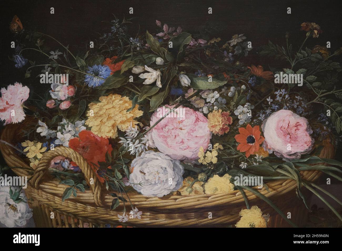An oil painting titled Flowers In A Basket And A Vase by the Flemish ...