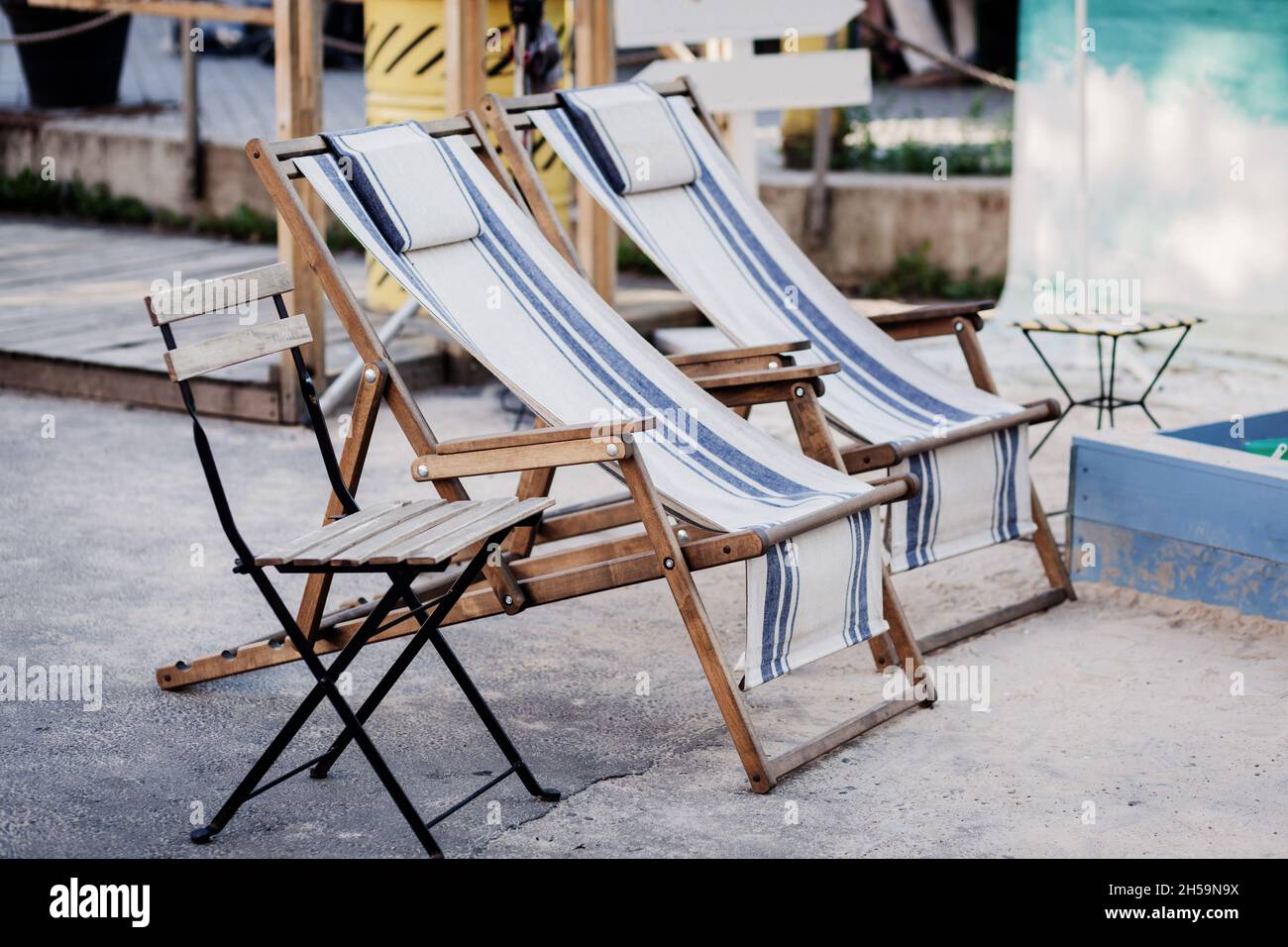 striped beach chairs. lounge zone Stock Photo - Alamy