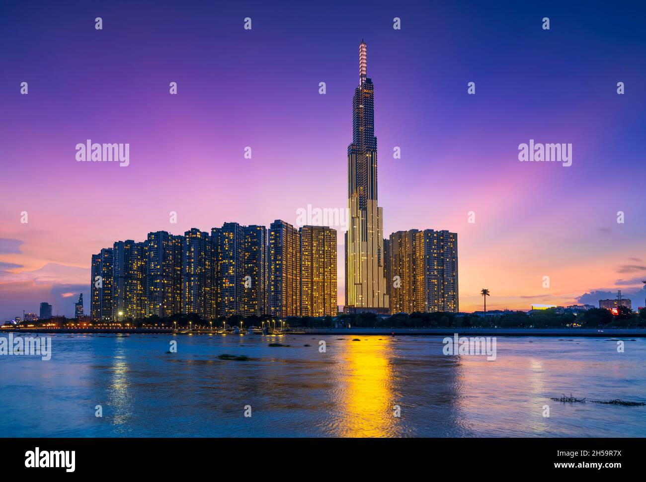 Riverside urban area at sunset sky after a period of social distancing ...