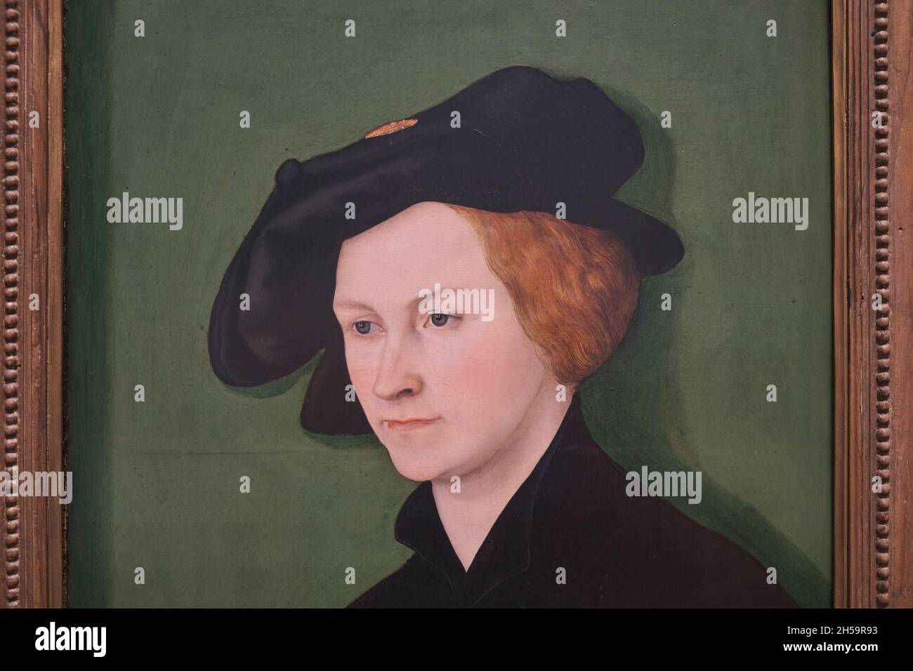 An oil painting on panel with green background titled Portrait of a Man ...