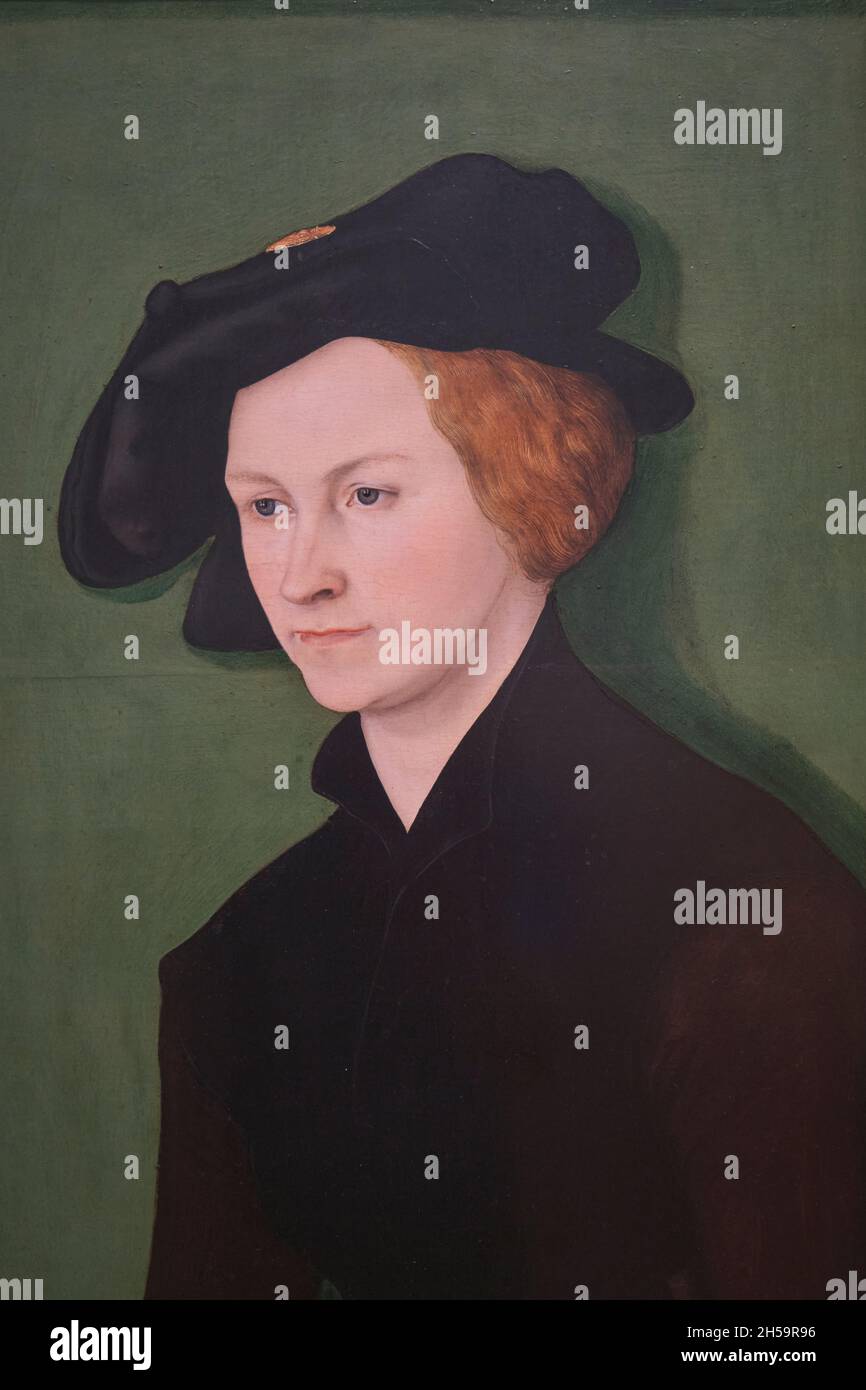 An oil painting on panel with green background titled Portrait of a Man ...