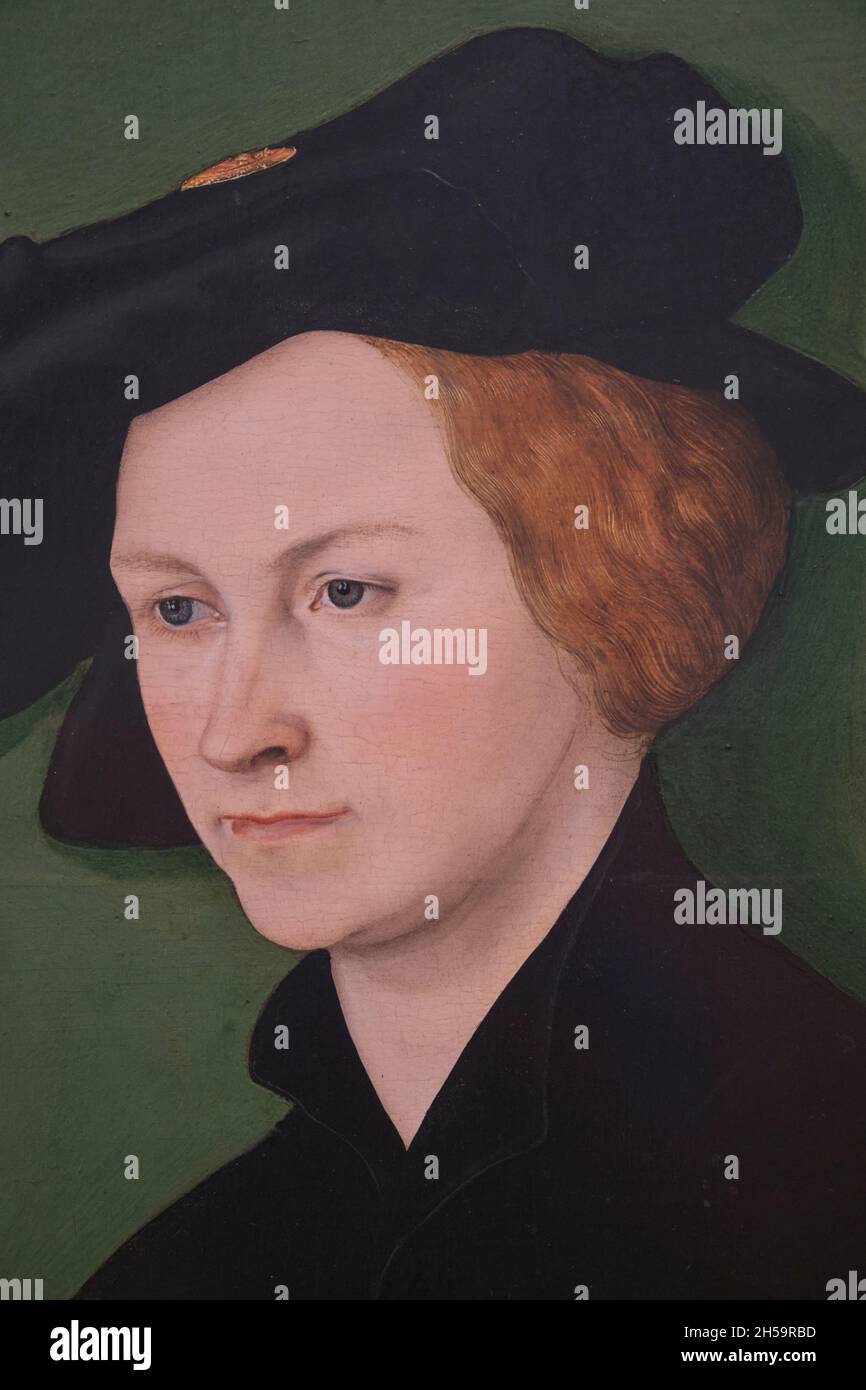 An oil painting on panel with green background titled Portrait of a Man ...